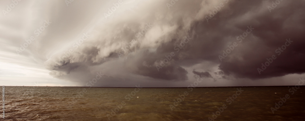 Cloudy storm in the sea before rainy.tornado storms cloud above the sea ...