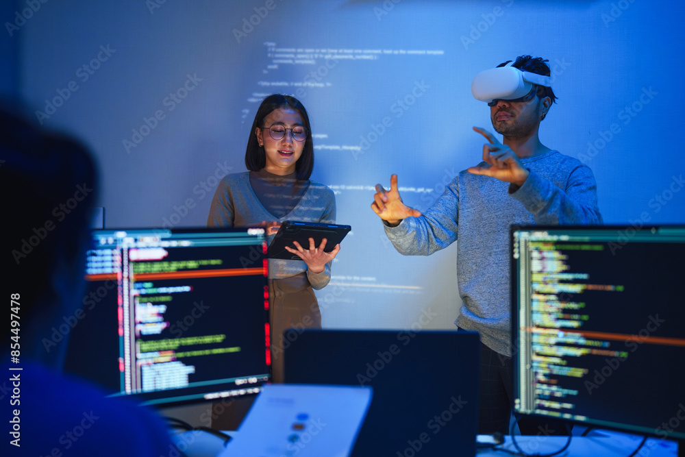 developer uses a VR headset to interact with projected interface ...