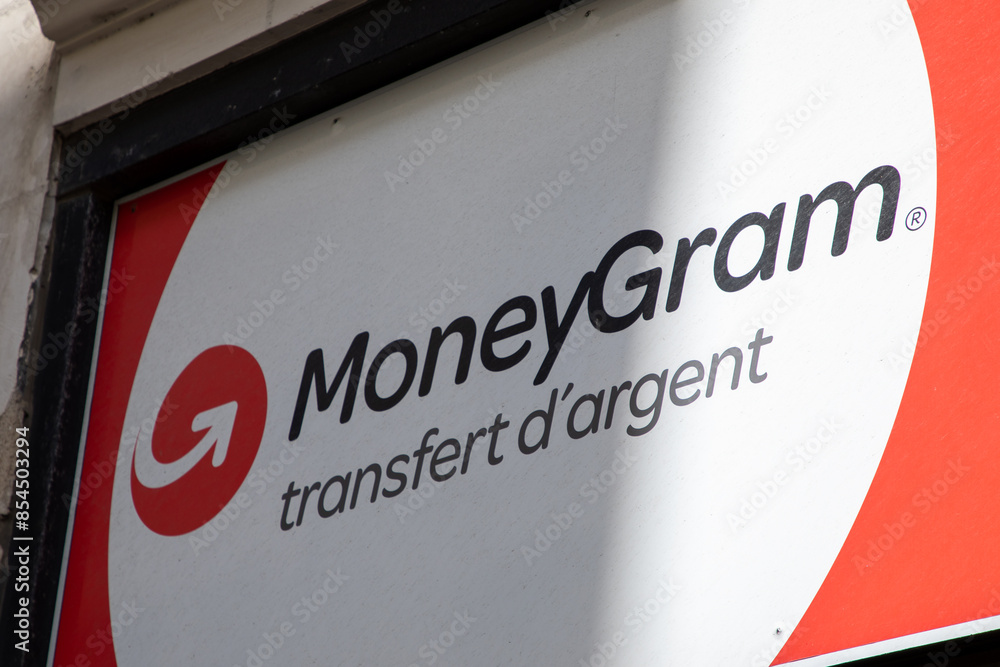 MoneyGram sign text and brand logo front of agency shop ice currency ...