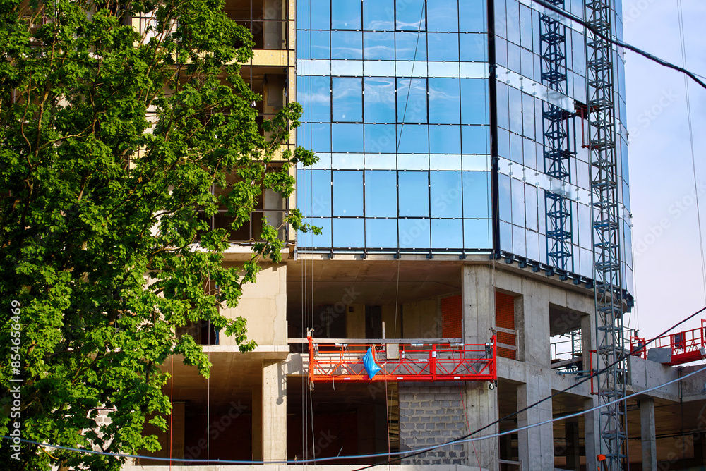 Suspended platform, installation of glass facade, warming exterior ...
