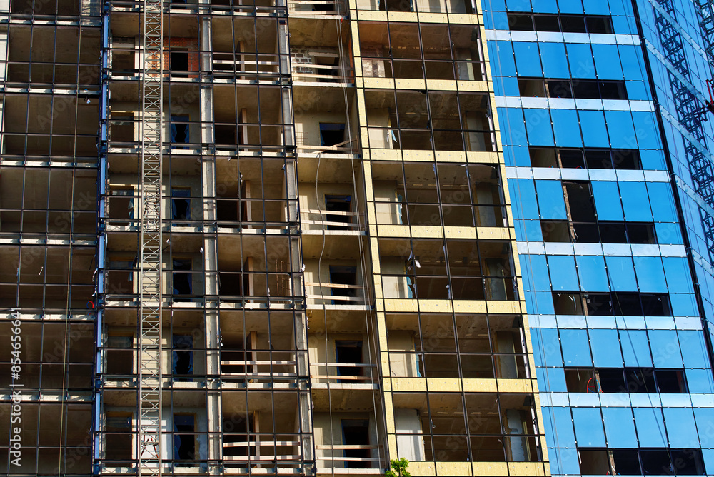 Precast glass facade panels installation, building under construction ...