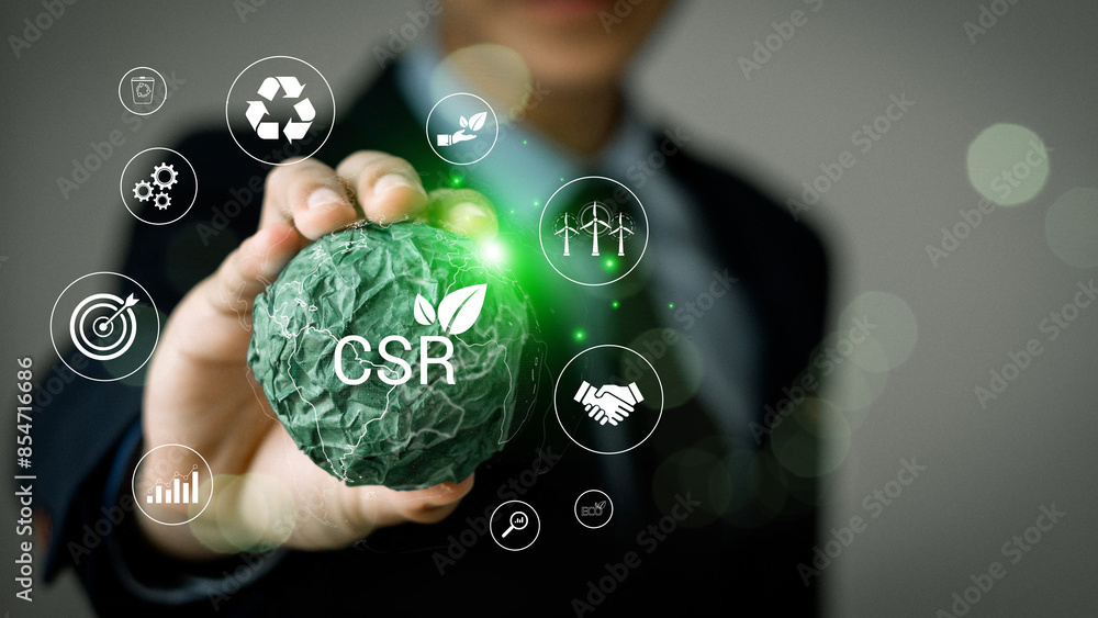 business hands holding the green world for the Sustainable Development Goals.Corporate social ...