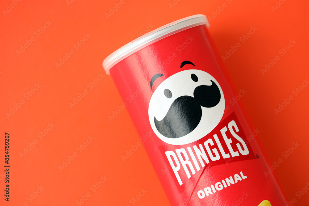 KYIV, UKRAINE - APRIL 20, 2024 Pringles original potato chips on red ...