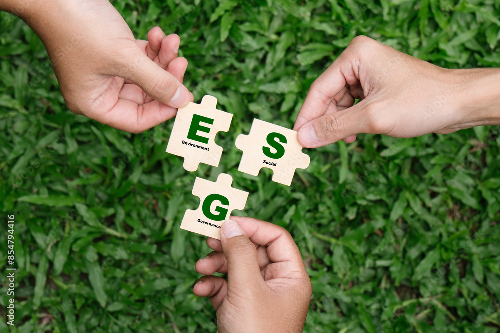 ESG environment social governance. Group of Businessman holding puzzle ...