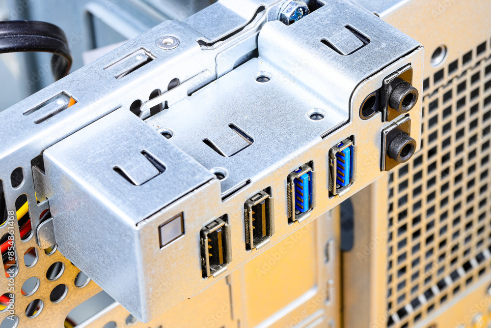 Multiple ports on front of computer case show with USB and audio ports ...