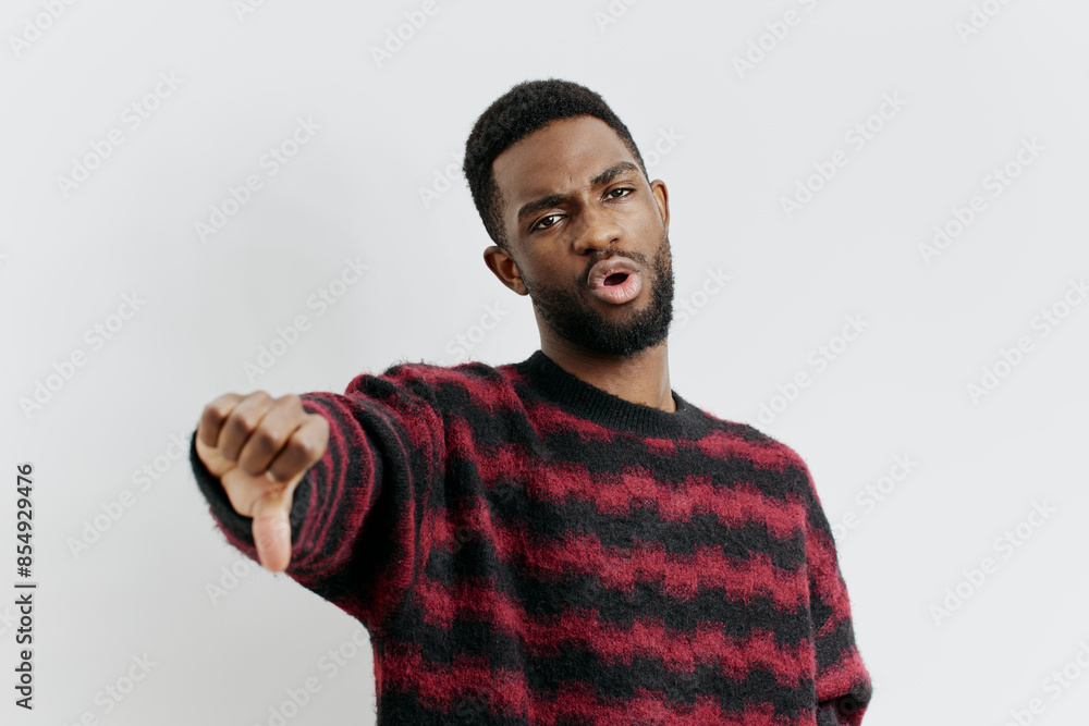 Confident man in red and black sweater directly pointing at camera ...