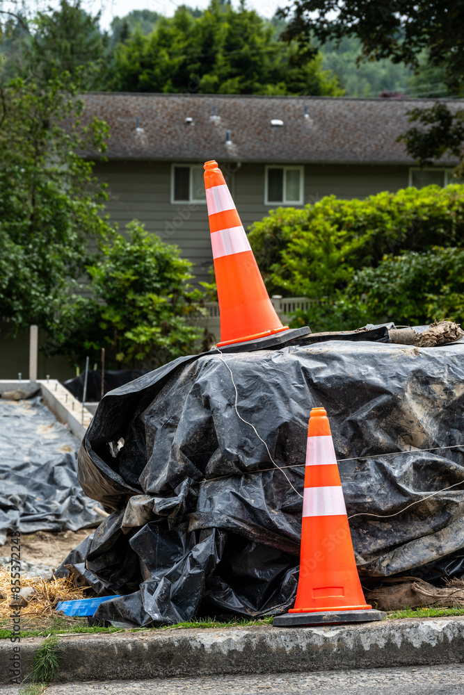 New home construction, pile of materials delivered and covered in a ...