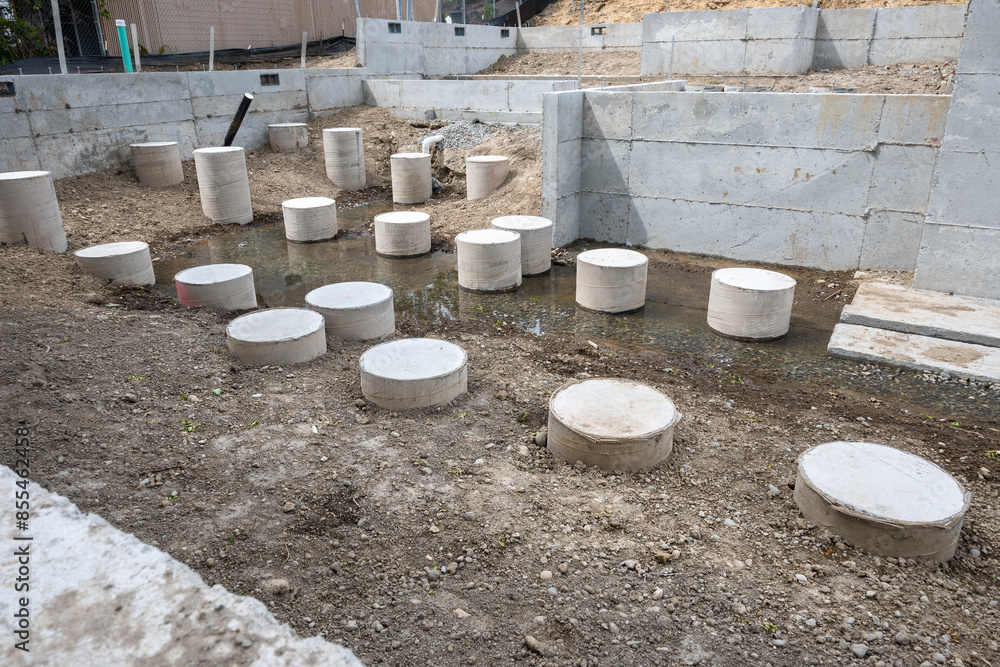 New home foundation construction in progress, cement retaining walls in ...