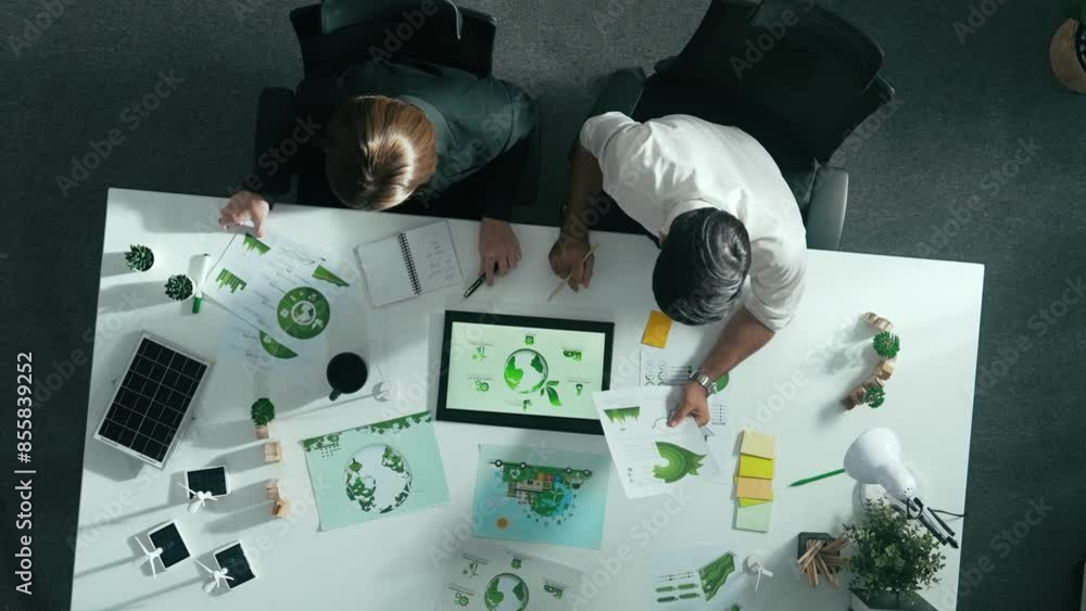 Top down view of business man presenting sustainable idea to manager by ...