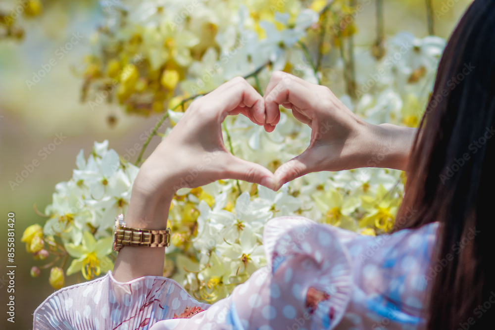 woman raises her hands make heart symbol meaning love and friendship on ...