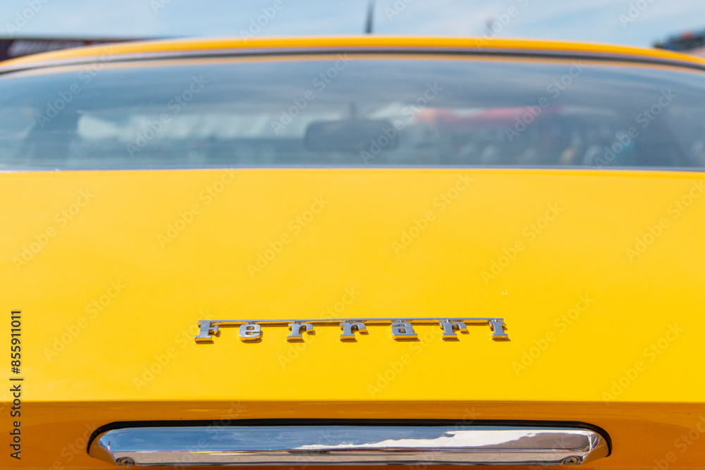 Ferrari, letters and logo with the name of this sports car on the red ...