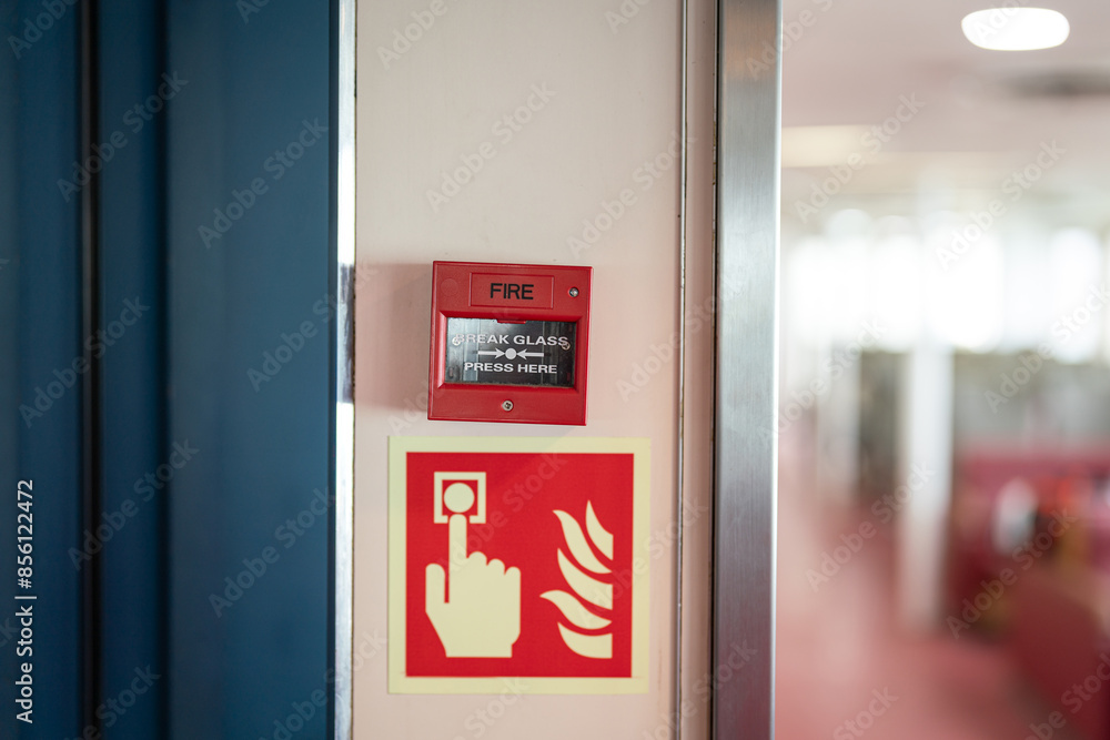 Fire alarm device that installed on building wall, press the button to ...
