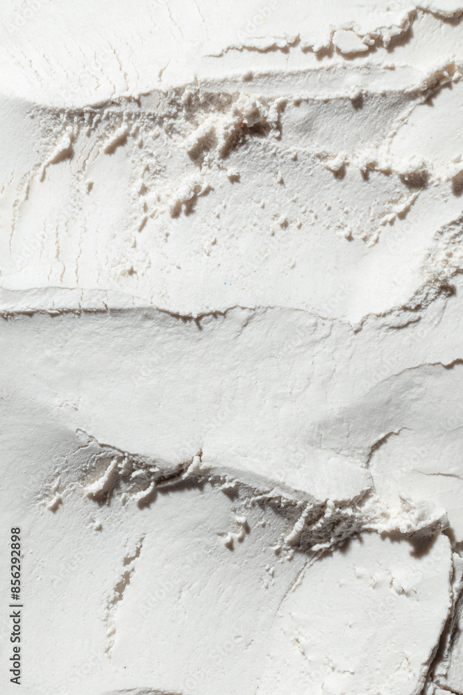 Macro shot of a white powdery texture displaying fine grains and rough ...