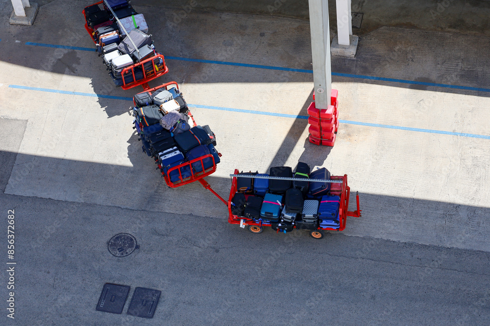 Top view of loaded luggage trolley carts to be loaded into a cruise ...