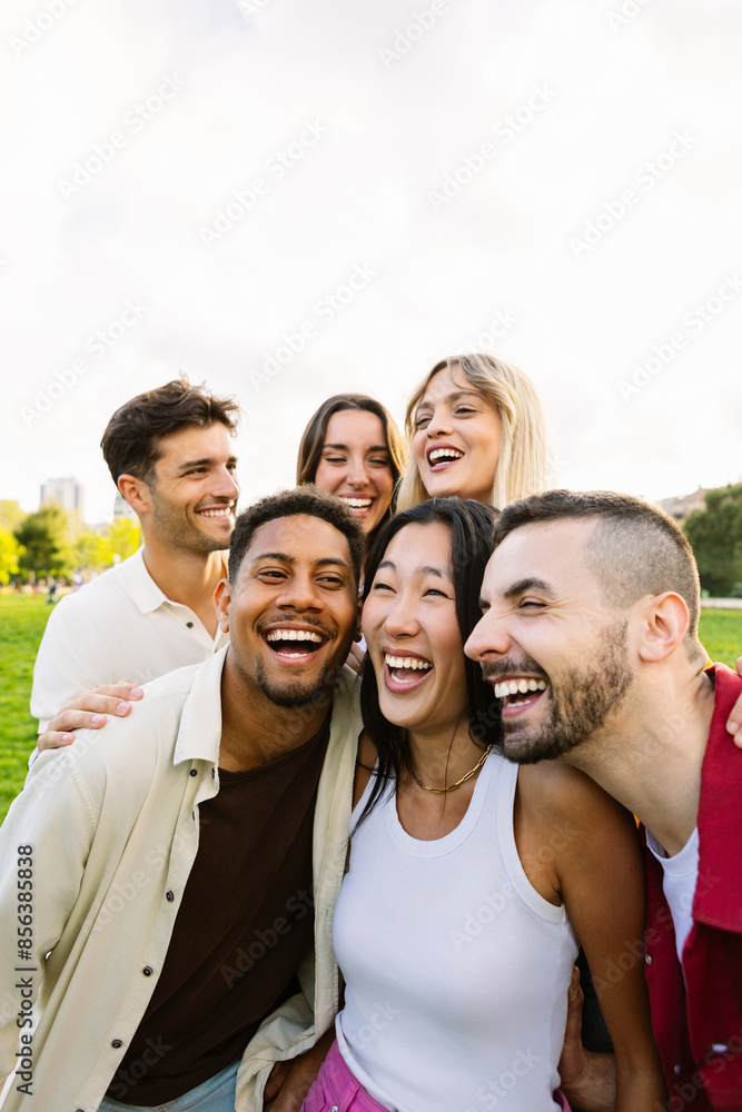 Vertical photo of happy young group of millennial friends having fun ...