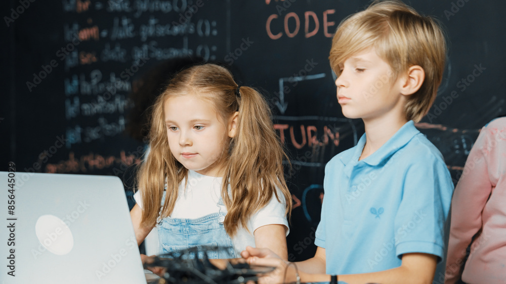 Smart girl using laptop programing engineering code with diverse ...