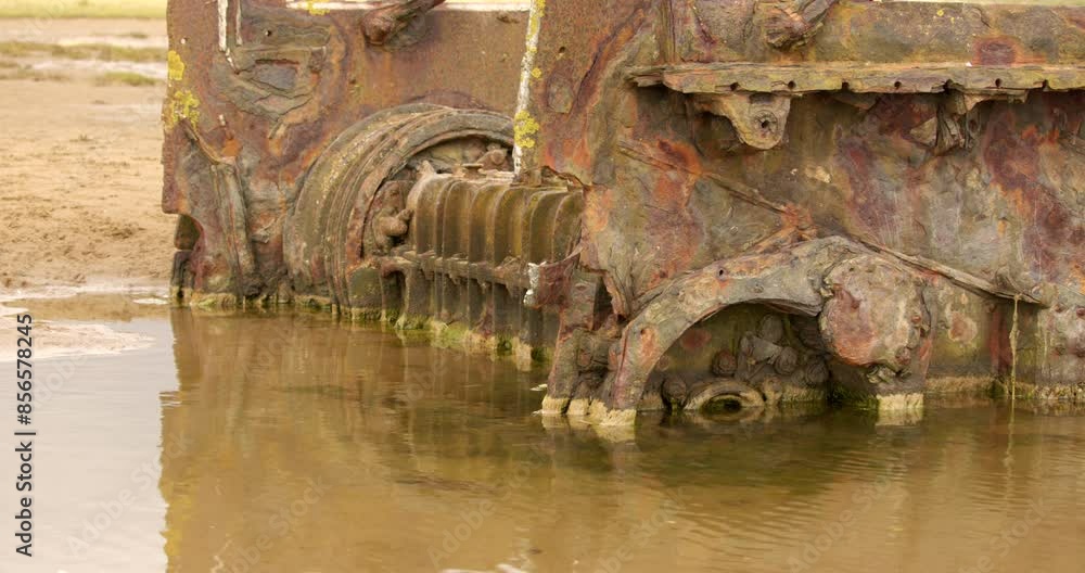 Mid shot of the tank on the beach. showing the right back side of the ...