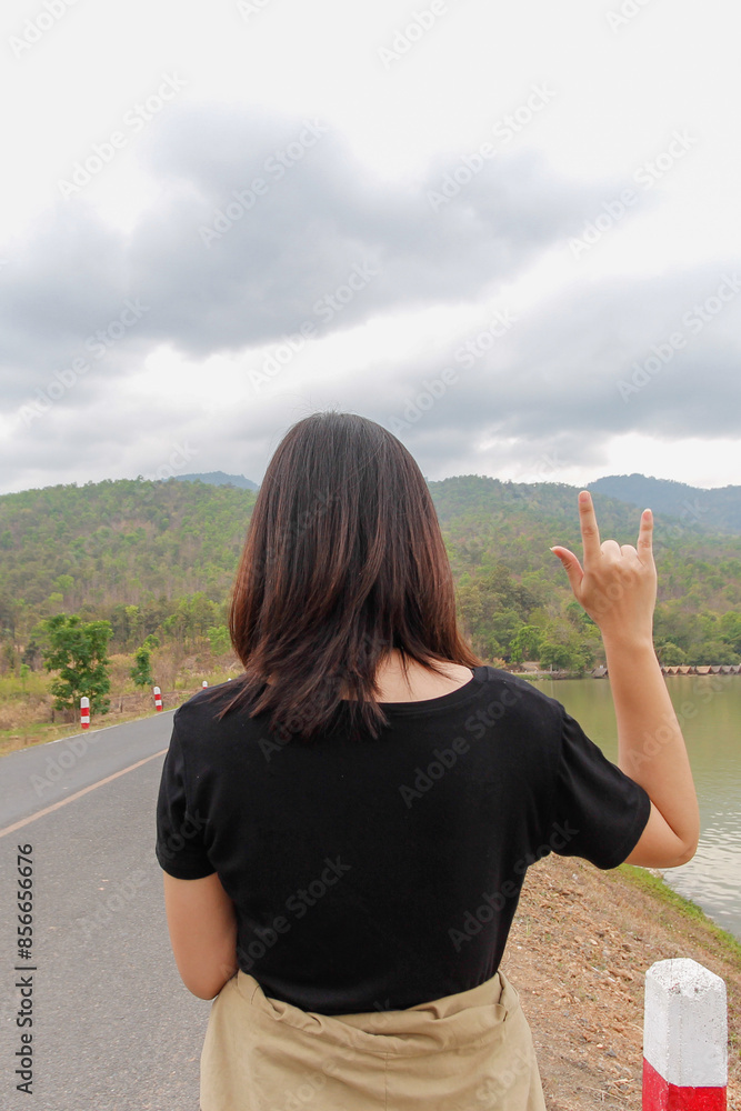 woman uses sign language I love you to express his love and friendship ...