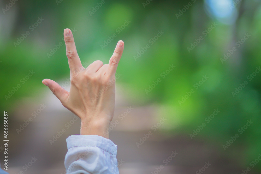 man uses sign language I love you to express his love and friendship ...