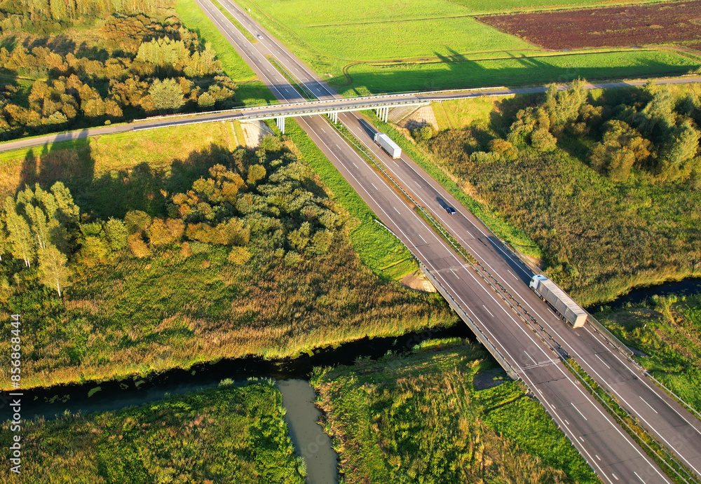 Semi truck with Semi-trailer driving along highway, drone view. Cars ...