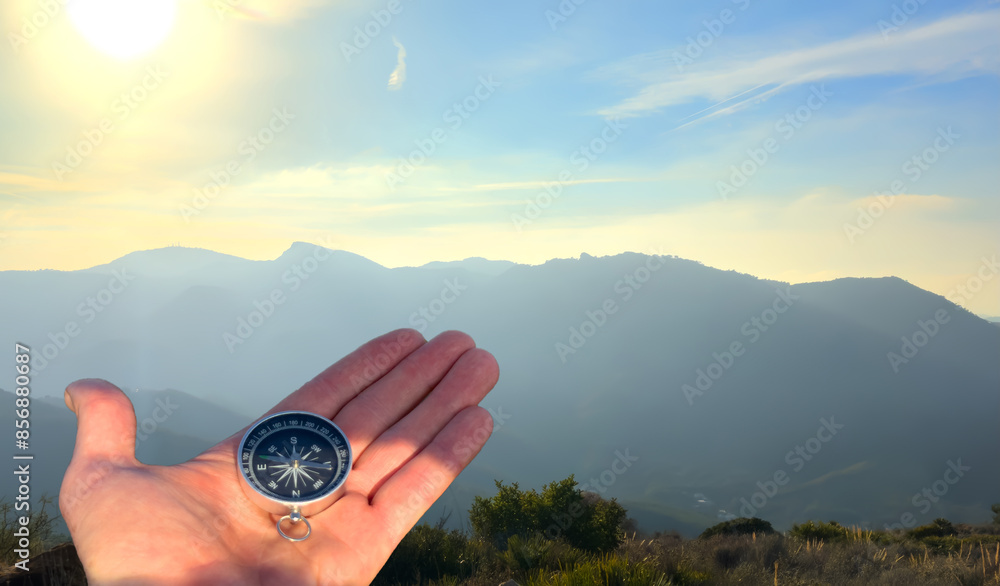 Compass in hand in mountains during Hiking. Tourist compass for ...