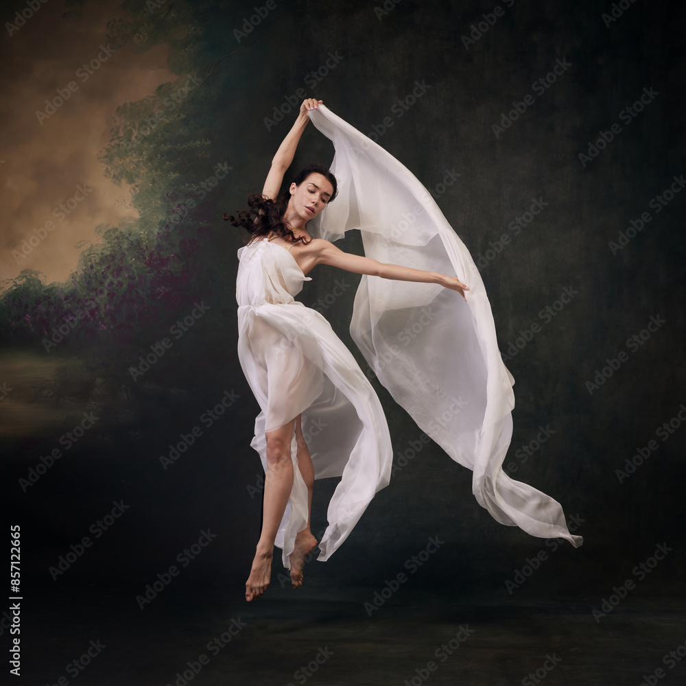 Draped in delicate fabric, dancer embodies lightness and fluidity in ...