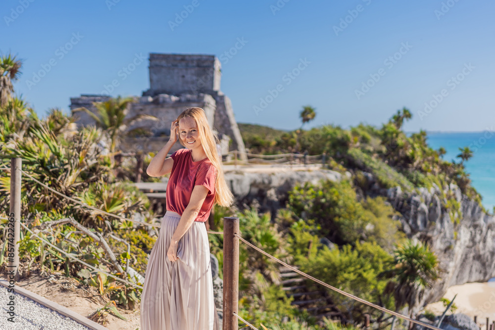 Woman tourist enjoying the view Pre-Columbian Mayan walled city of ...