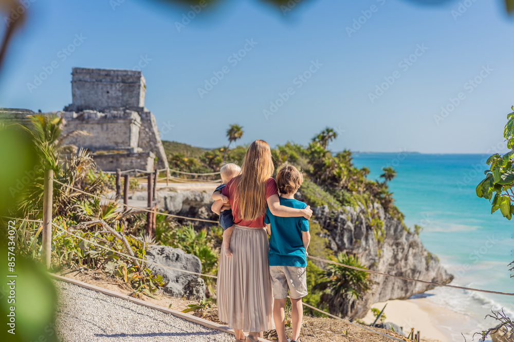 Mother and two sons tourists enjoying the view Pre-Columbian Mayan ...