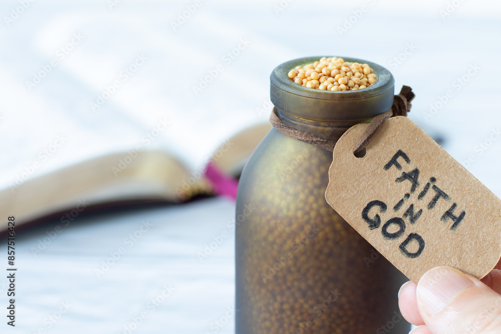 Hand-holding handwritten note: Faith in God on a bottle with mustard ...