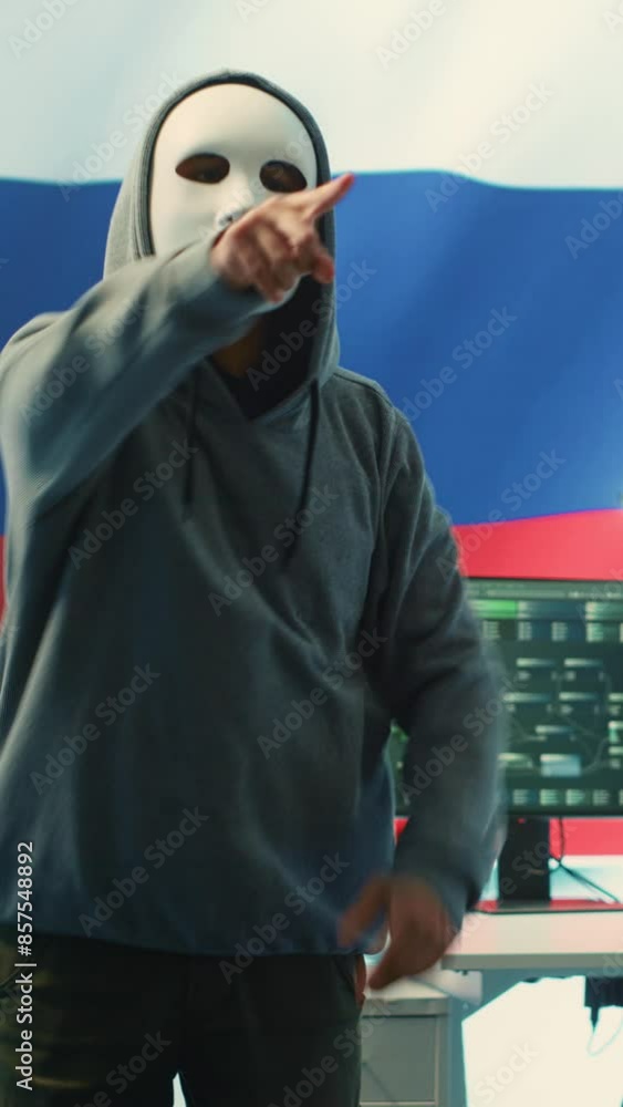 Vertical Video Anonymous person with mask asks for ransom in Russian ...