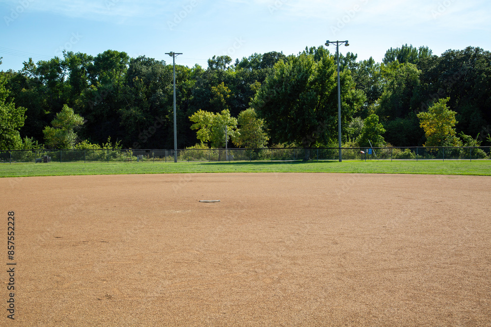 Empty Small Town Baseball Field Park under a Clear Blue Sky. Features ...