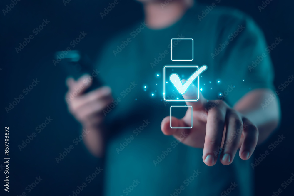 Hands check the checklist manually and fill out the online survey form ...