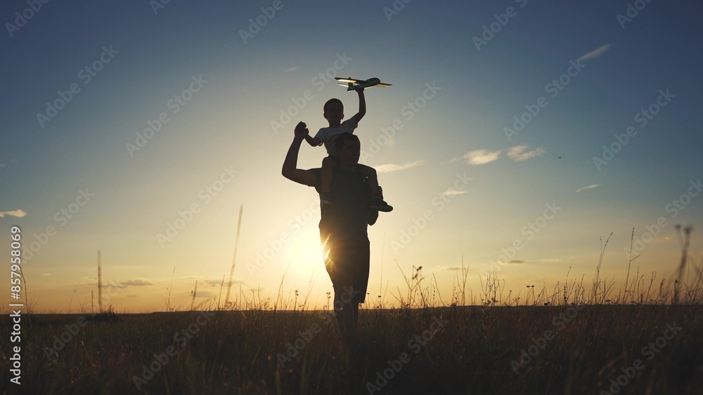 Silhouette of father and son bending his neck. Daughter parent beach ...