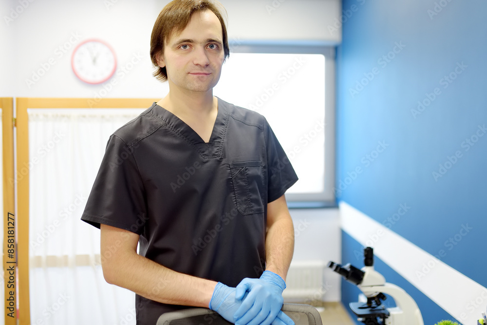 Portrait of a male dermatologist in the office of a modern clinic. A ...