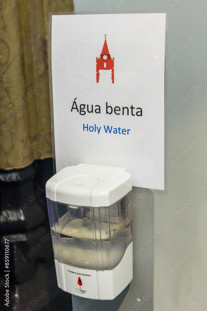 Água benta (tr: Holy water) dispenser at the entrance of a Roman ...