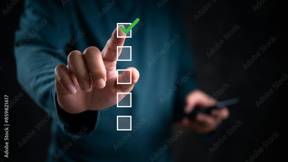 Hand touching checklist, green check mark highlighted. Concept of task ...
