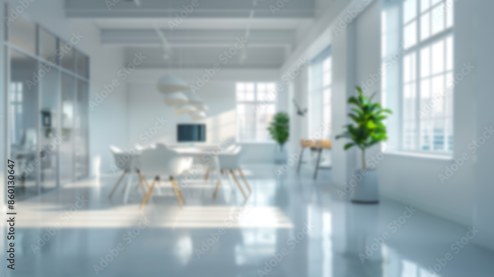 Blur background of an open-plan white office with large windows, sleek ...