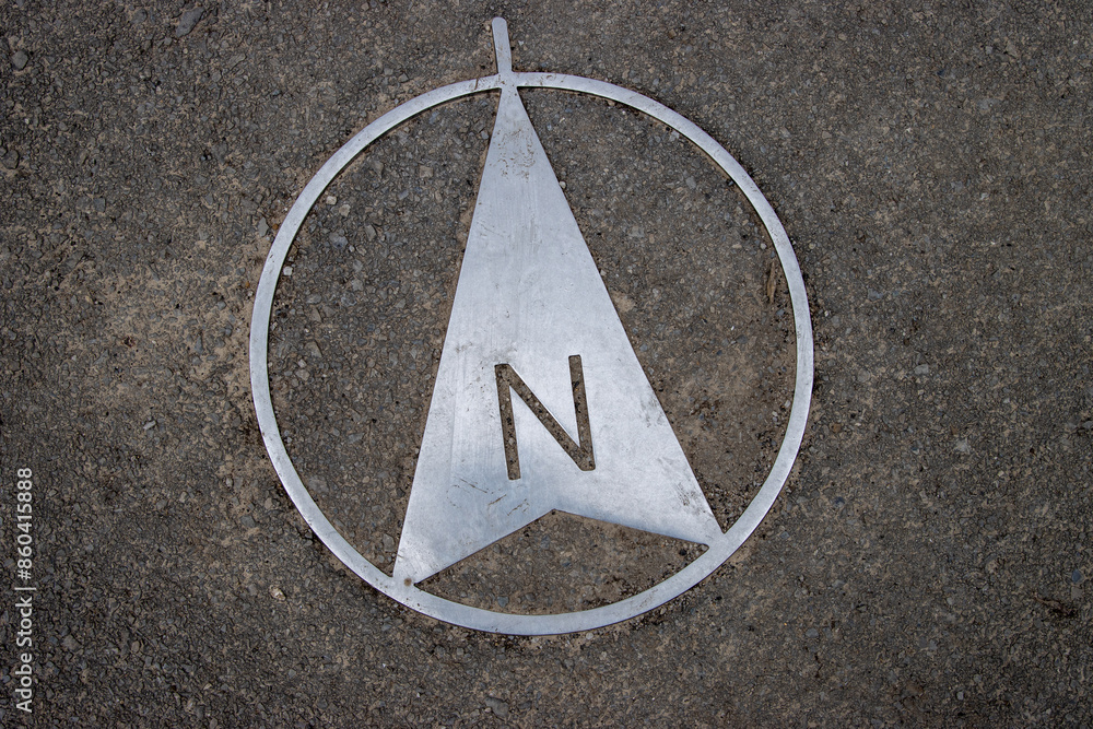 Compass symbol on pavement pointing north and denoting north Stock ...