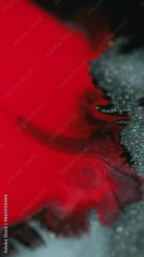 Vertical video. Ink spill. Paint splatter. Blur red silver black color ...