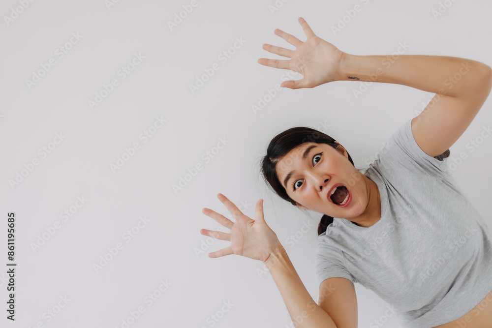 Wow and shocked funny face of Asian Thai woman, spreading arms and ...