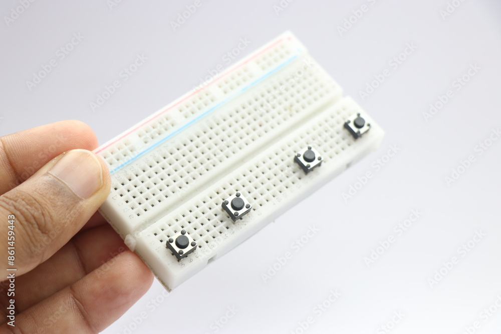 Tactile push buttons connected to a breadboard. Electronic prototyping ...
