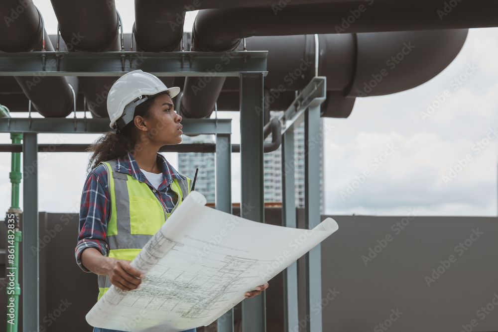 Engineers with draft plan of building on constructing site. Engineer ...