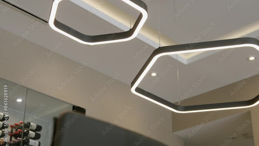 Modern interior lighting fixture with geometric design. Two ...
