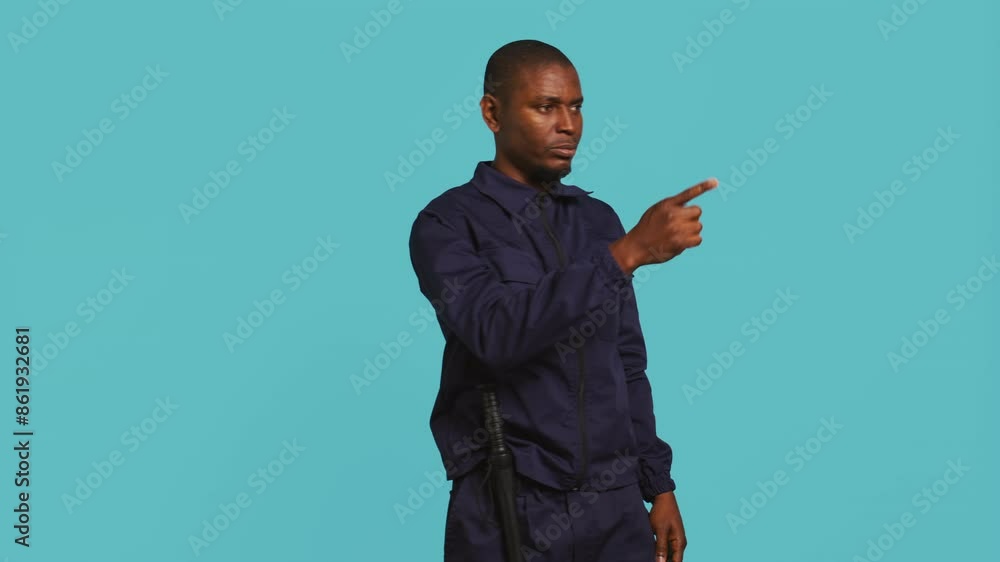 Portrait of security agent pointing finger at people, warning them ...