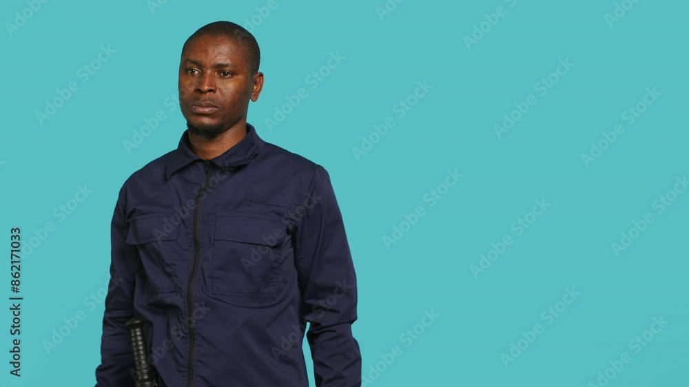 Security guard doing salute hand gesture, preparing to start job of ...