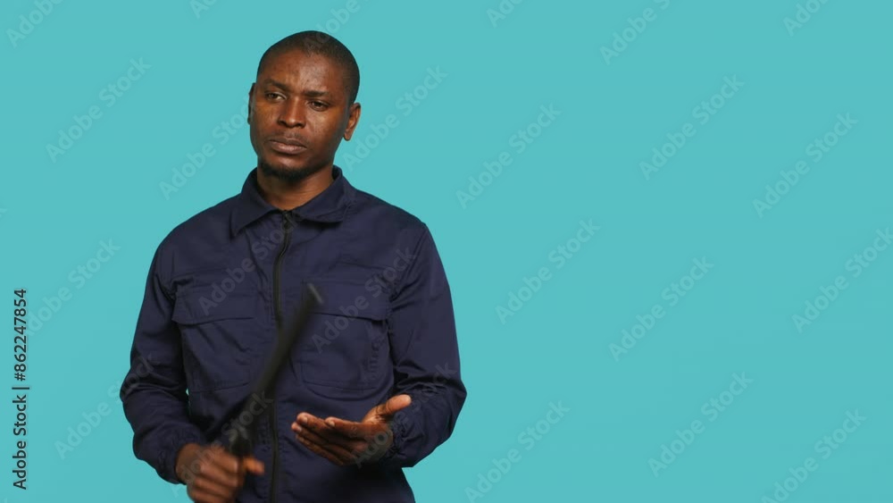 Security guard smacking hand with baton, intimidating suspects ...