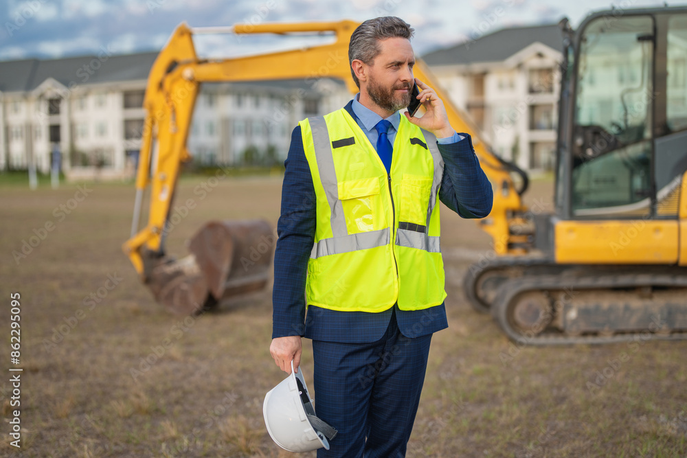 Civil engineer worker at a construction site. Mature engineer worker ...