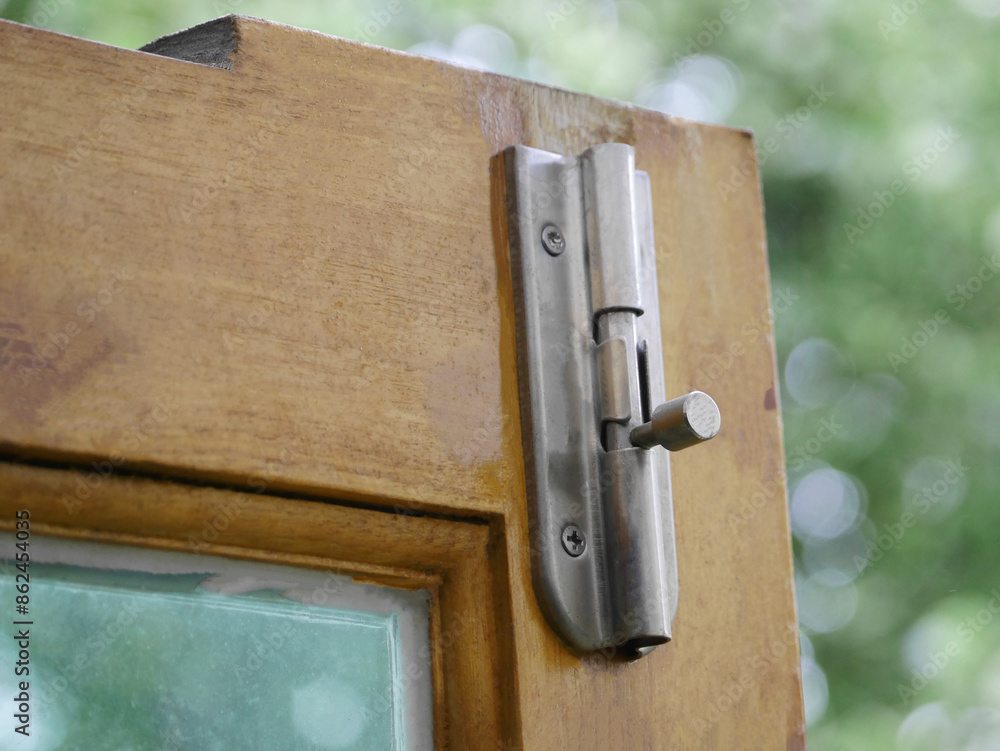 metal door latch lock, closed and locked brown wood door with latch ...