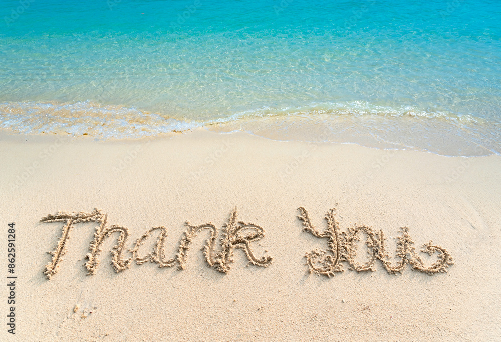 Thank you lettering on the beach with wave and clear blue sea. Thank ...
