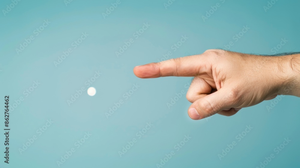 Foto de A hand with a pointing finger pointing at a target, symbolizing ...